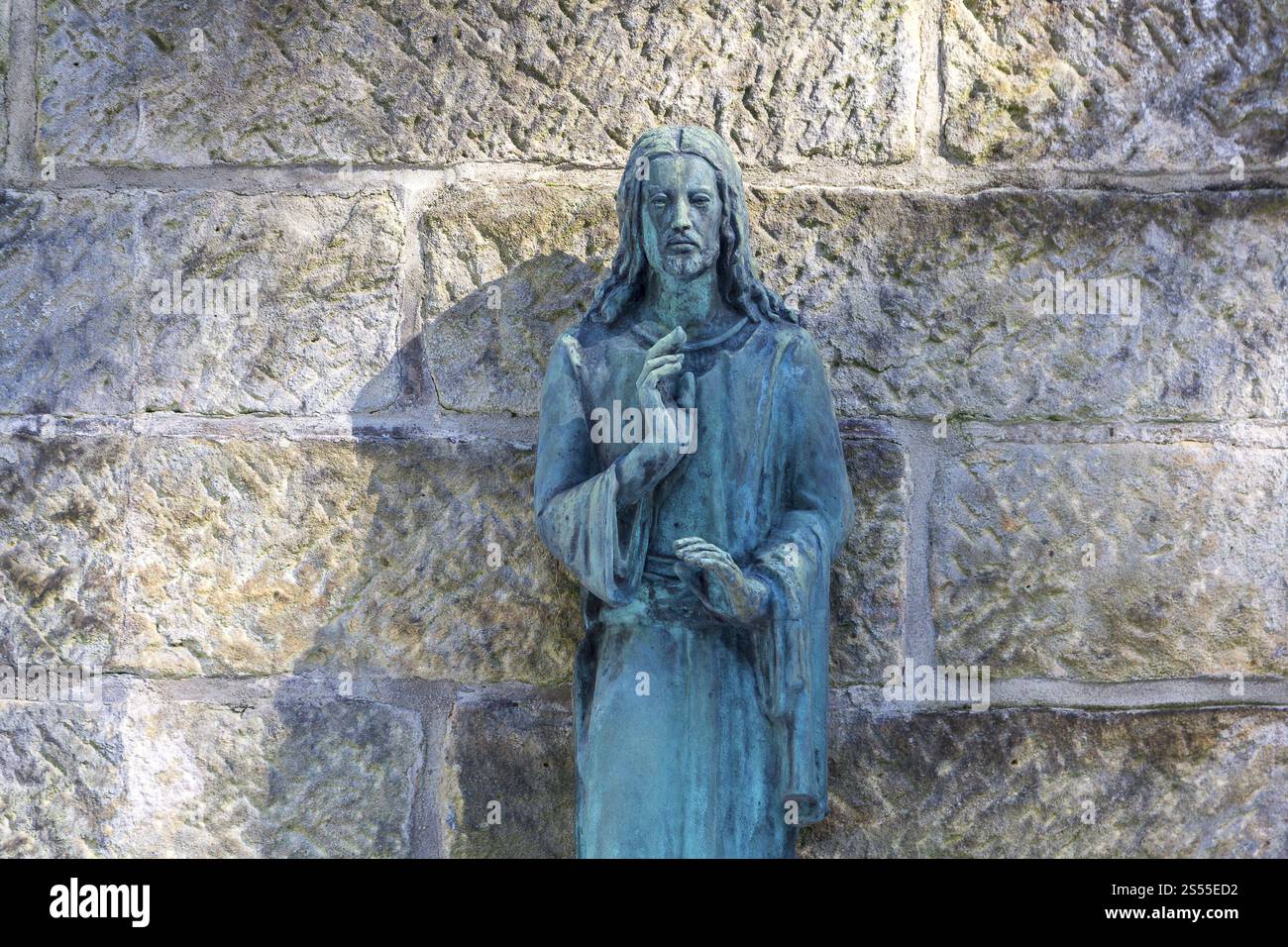 Figure of Christ in front of a wall, Dresden Forest Cemetery, Saxony ...