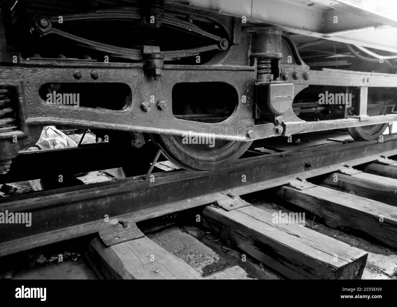 Closeup black and white photo of old vintage tram wheels on rails ...