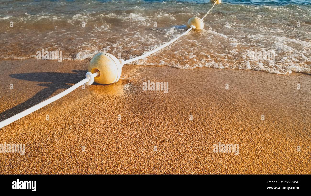 Closeup photo of calm sea waves rolling and braking on the floating ...