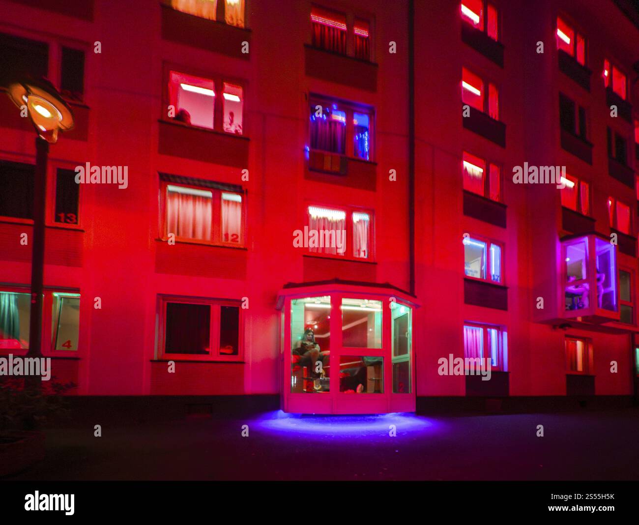 Laufhaus, prostitutes in the windows and showcases of a red-lit brothel ...