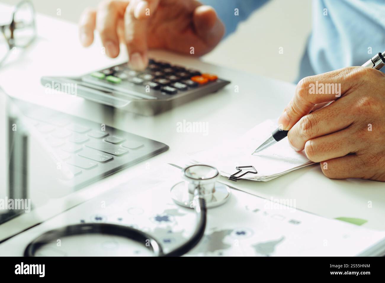 Healthcare costs and fees concept.Hand of smart doctor used a ...