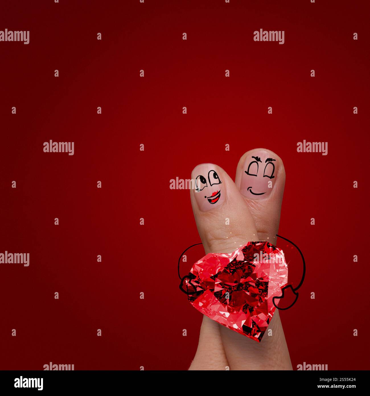 the happy finger couple in love with painted smiley and hold diamond ...