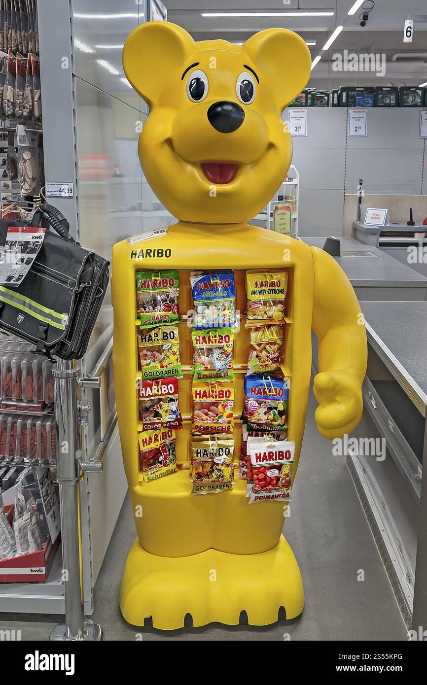 Plastic haribo bear as advertising and merchandise stand in a DIY store ...