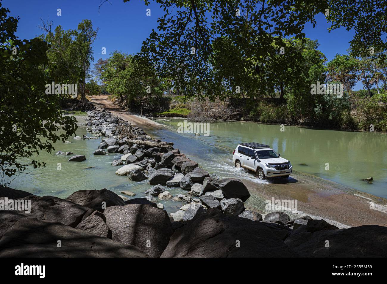 A vehicle crosses the Cahill Crossing ford through the East Alligator ...