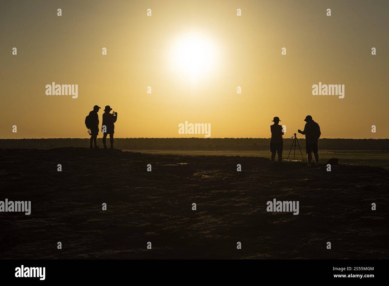 Tourists experience the sunset at Nadab Lookout on the Nadab Floodplains, Ubirr, Kakadu National ...