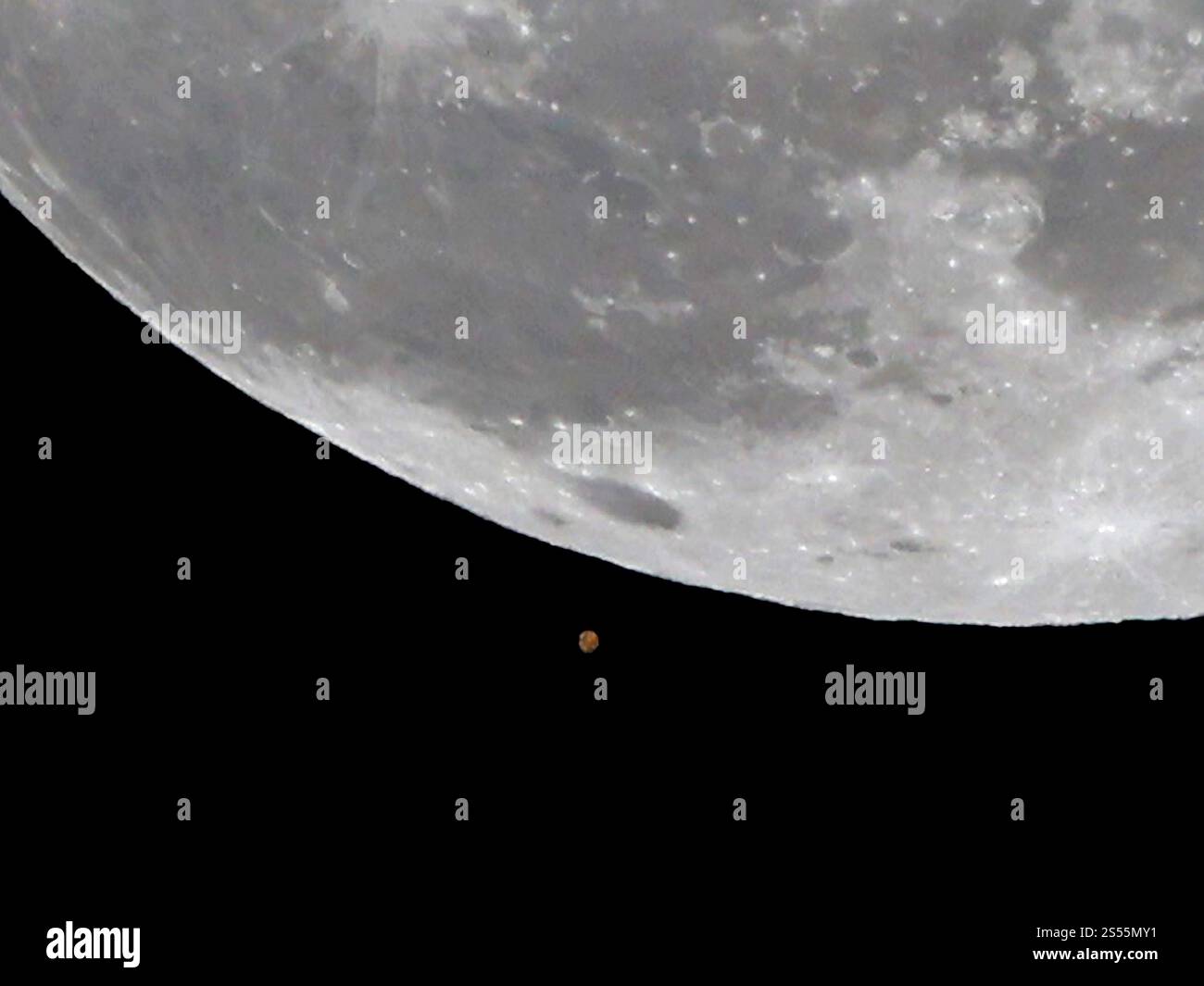 New York, United States. 13th Jan, 2025. Mars moves close before ...