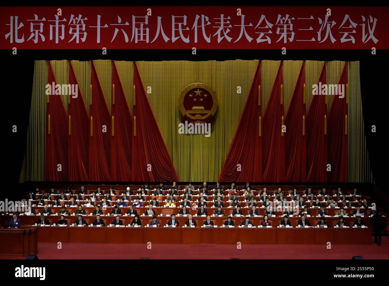 Chinese leaders listen to the speech of Beijing Mayor Yin Yong, bottom ...