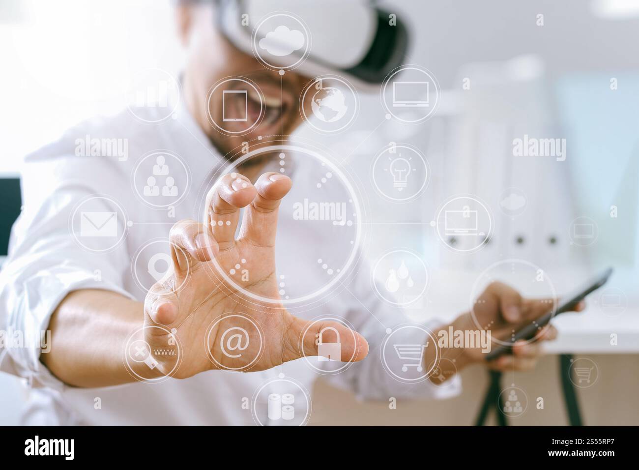 businessman wearing virtual reality goggles in modern office with ...