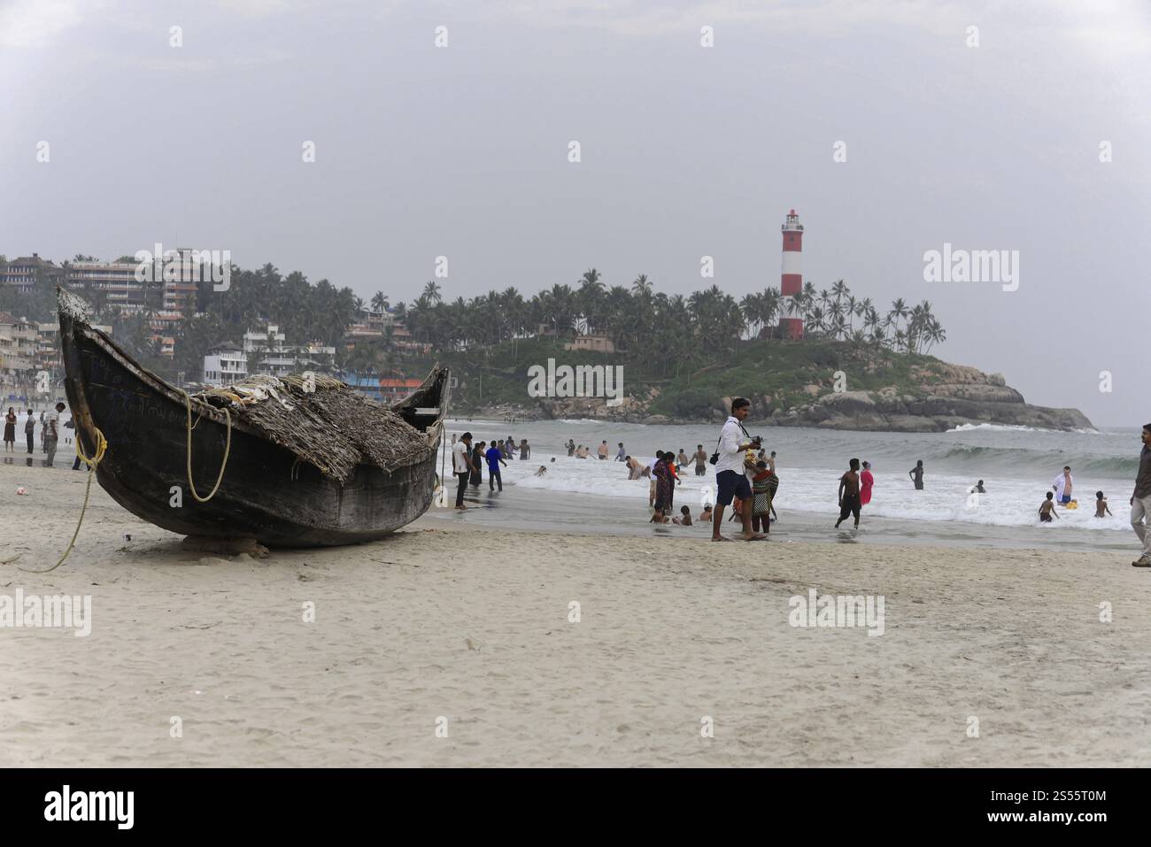 Kovalam Beach, South India, India, Asia, An ancient boat rests on the ...