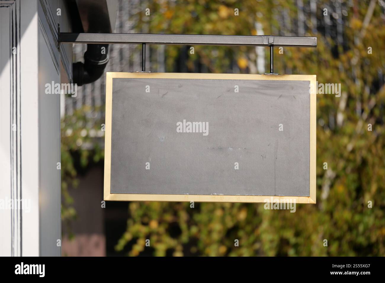 An empty chalkboard sign is currently hanging outside, awaiting ...