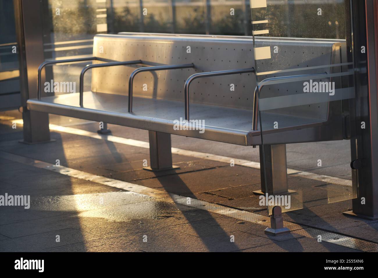Modern Bus Stop Bench with Glass, beautifully reflecting sunlight Stock ...
