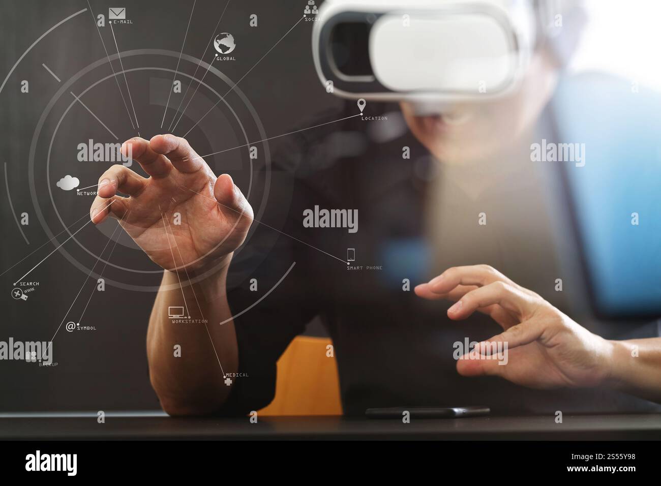 businessman wearing virtual reality goggles in modern office with ...