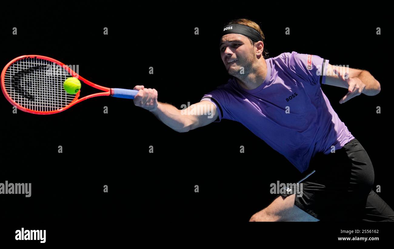 Taylor Fritz of the U.S. plays a forehand return to Jenson Brooksby of ...