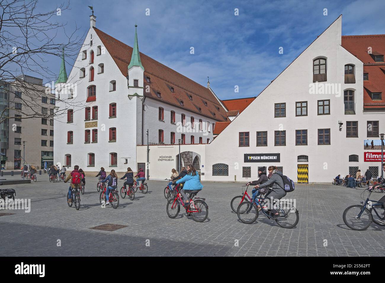 The Munich City Museum and Film Museum with cyclists at Jakobsplatz ...