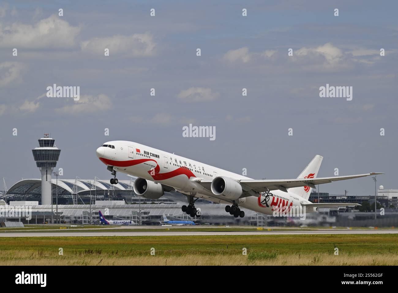 Air China Boeing B777-300 taking off on runway south with control tower ...