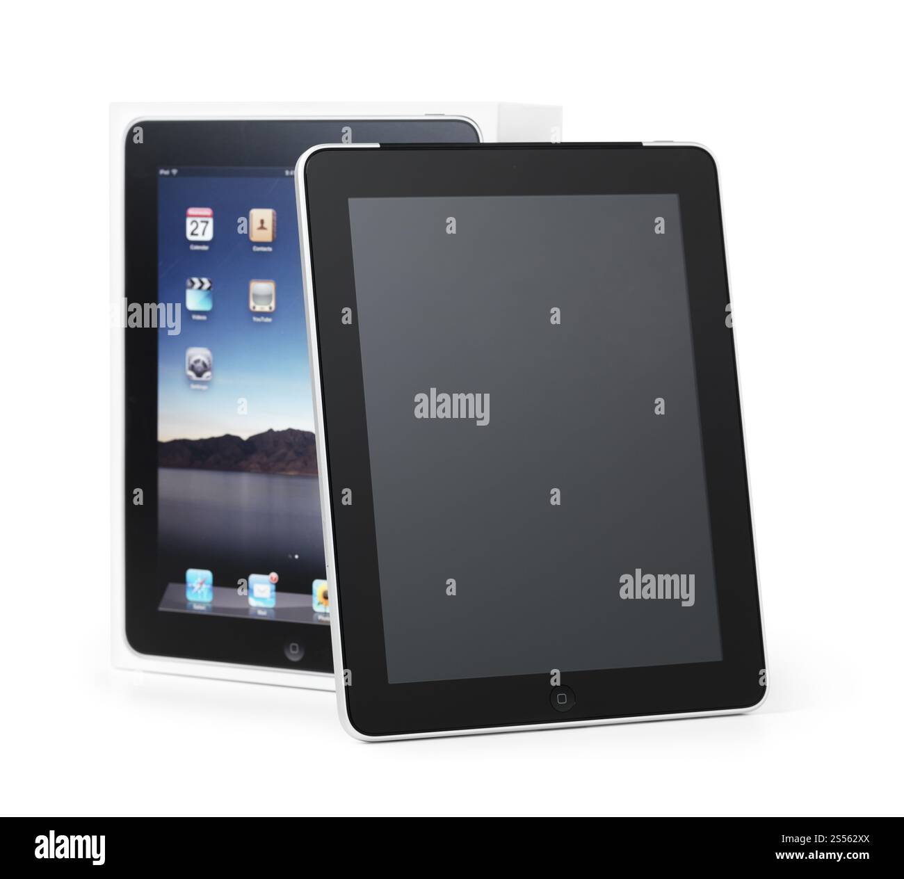 Apple iPad 3G tablet leaning against its packaging isolated on white ...