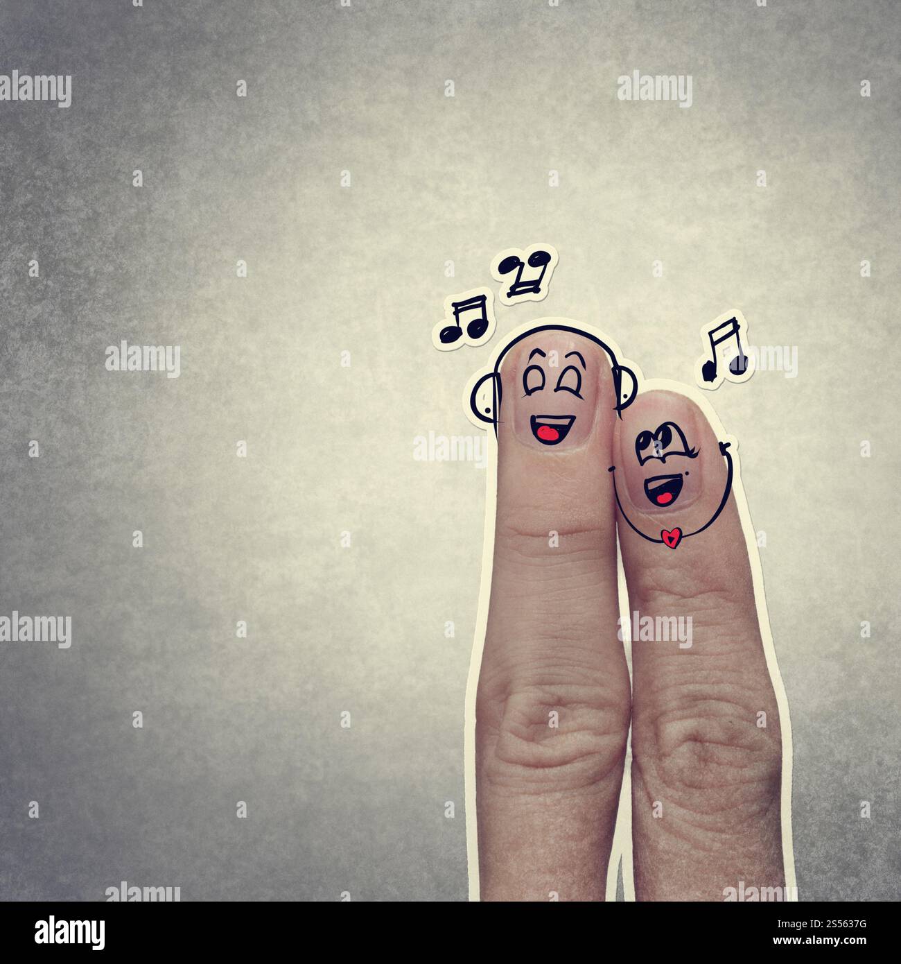 the happy finger couple in love with painted smiley and sing a song ...