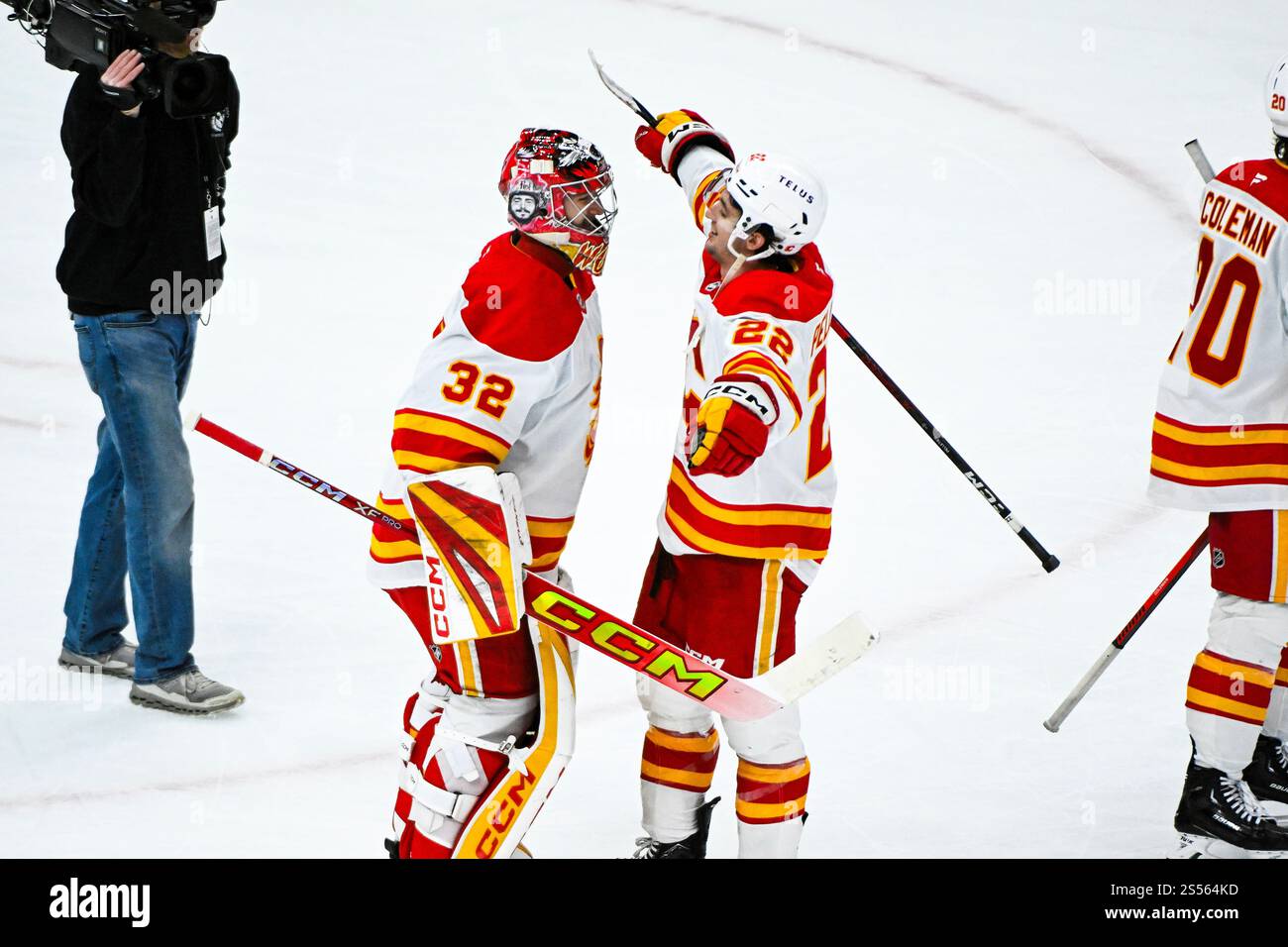 Calgary Flames goaltender Dustin Wolf (32) and left wing Jakob ...