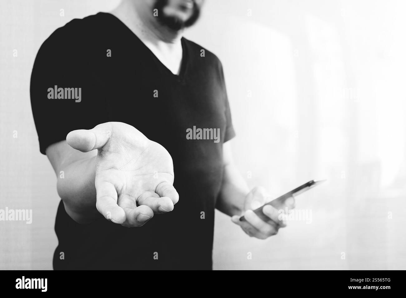 Designer hand pressing an imaginary button,open hand,holding smart ...