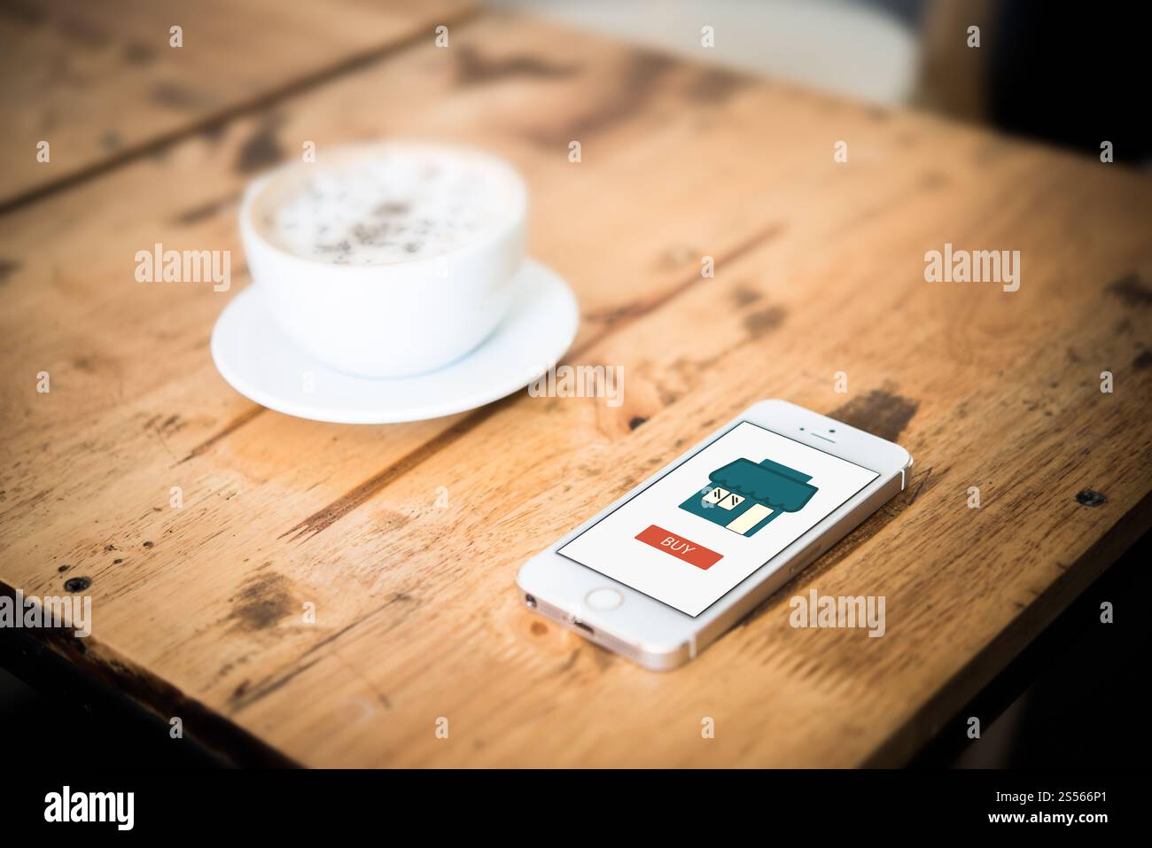 Smart phone online shopping. Desk with coffee in background. Buy stuff ...