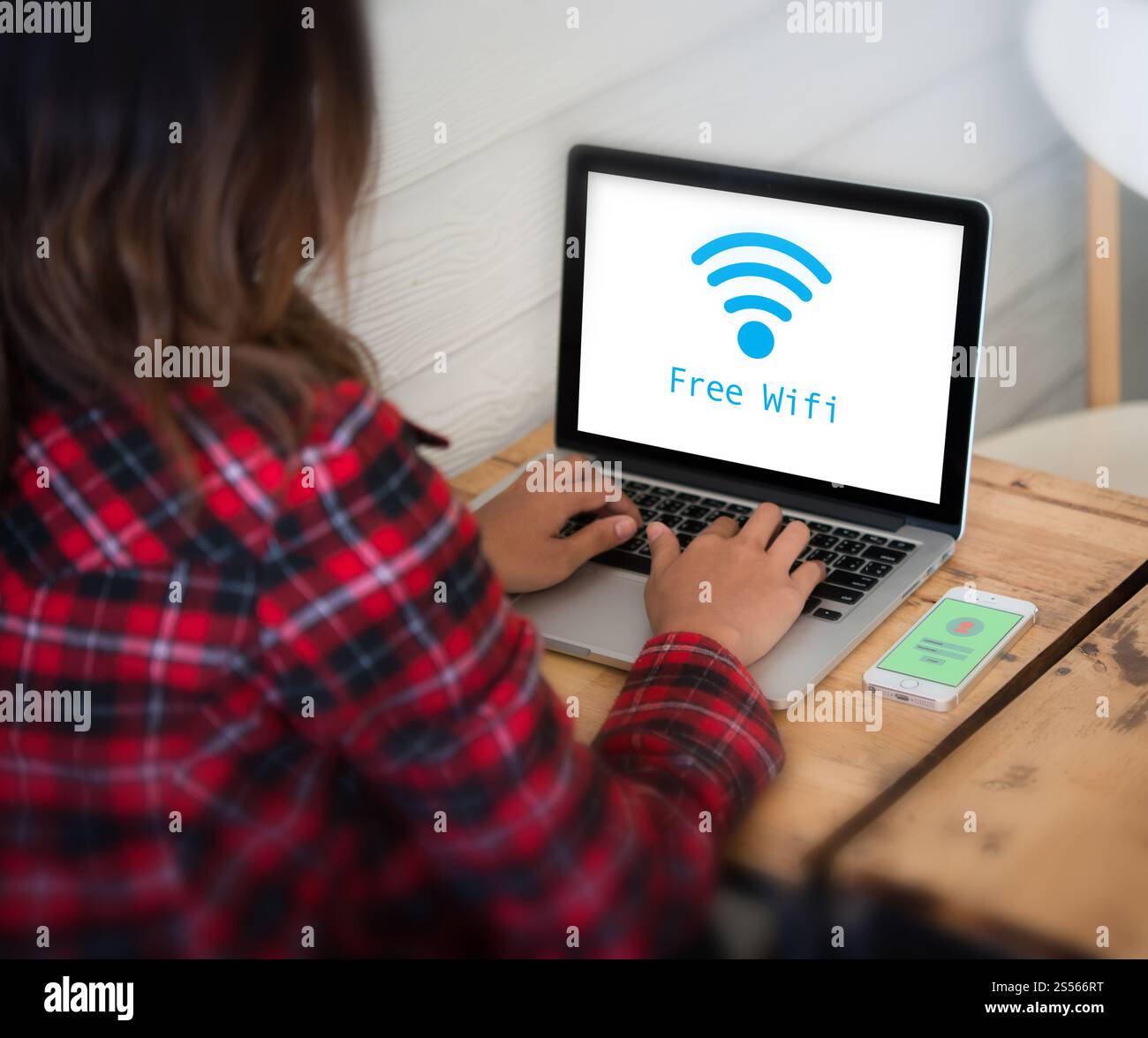 Wifi icon on laptop screen, Connecting network Stock Photo - Alamy