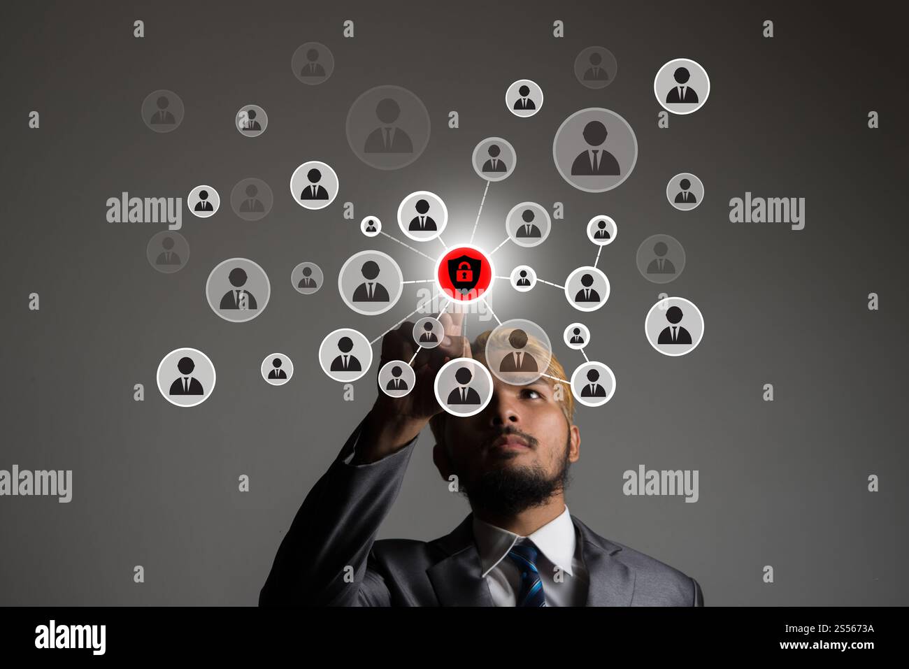 Young businessman pointing digital people icon network application in ...