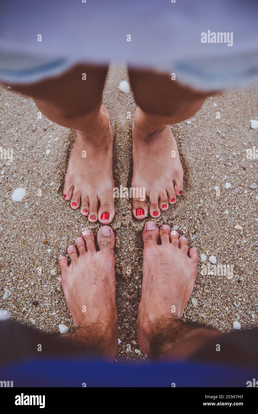 Young lover feet couple enjoying vacation on the beach together Stock ...