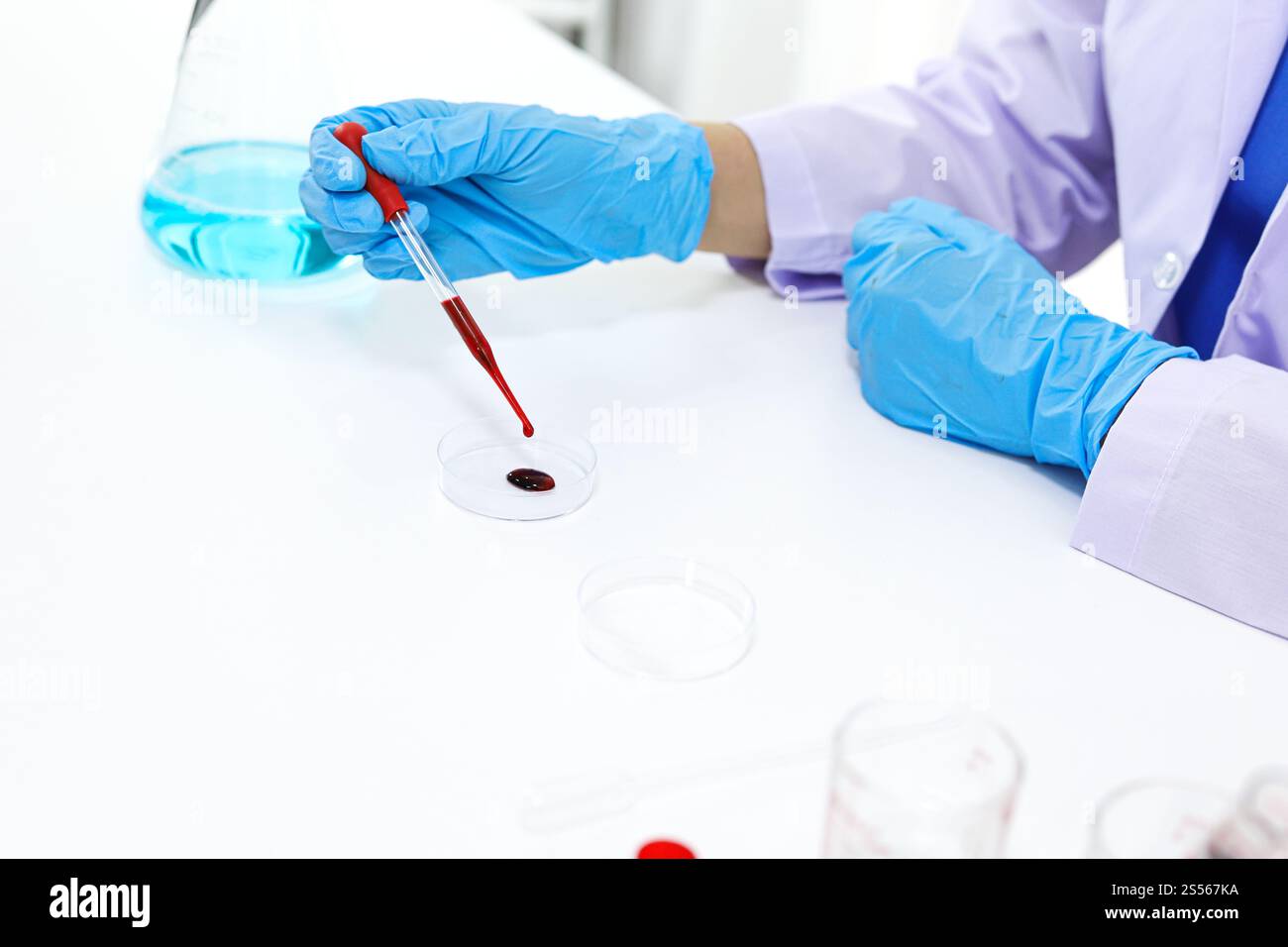 Scientist holding Coronavirus covid-19 infected blood sample tube. DNA ...