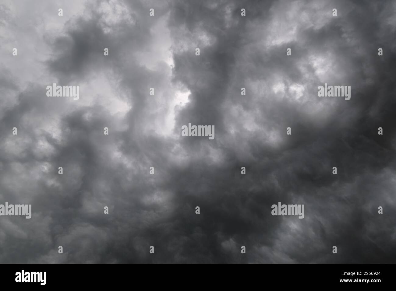 Dark dramatic cloudy overcast sky with thunderstorm clouds. Natural bad ...