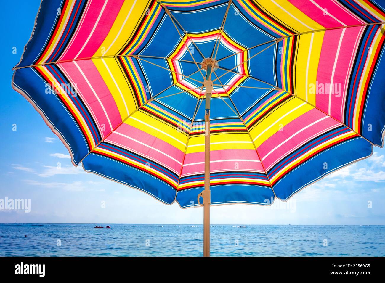 Colorful umbrella close-up view on a tropical beach. Colorful umbrella ...