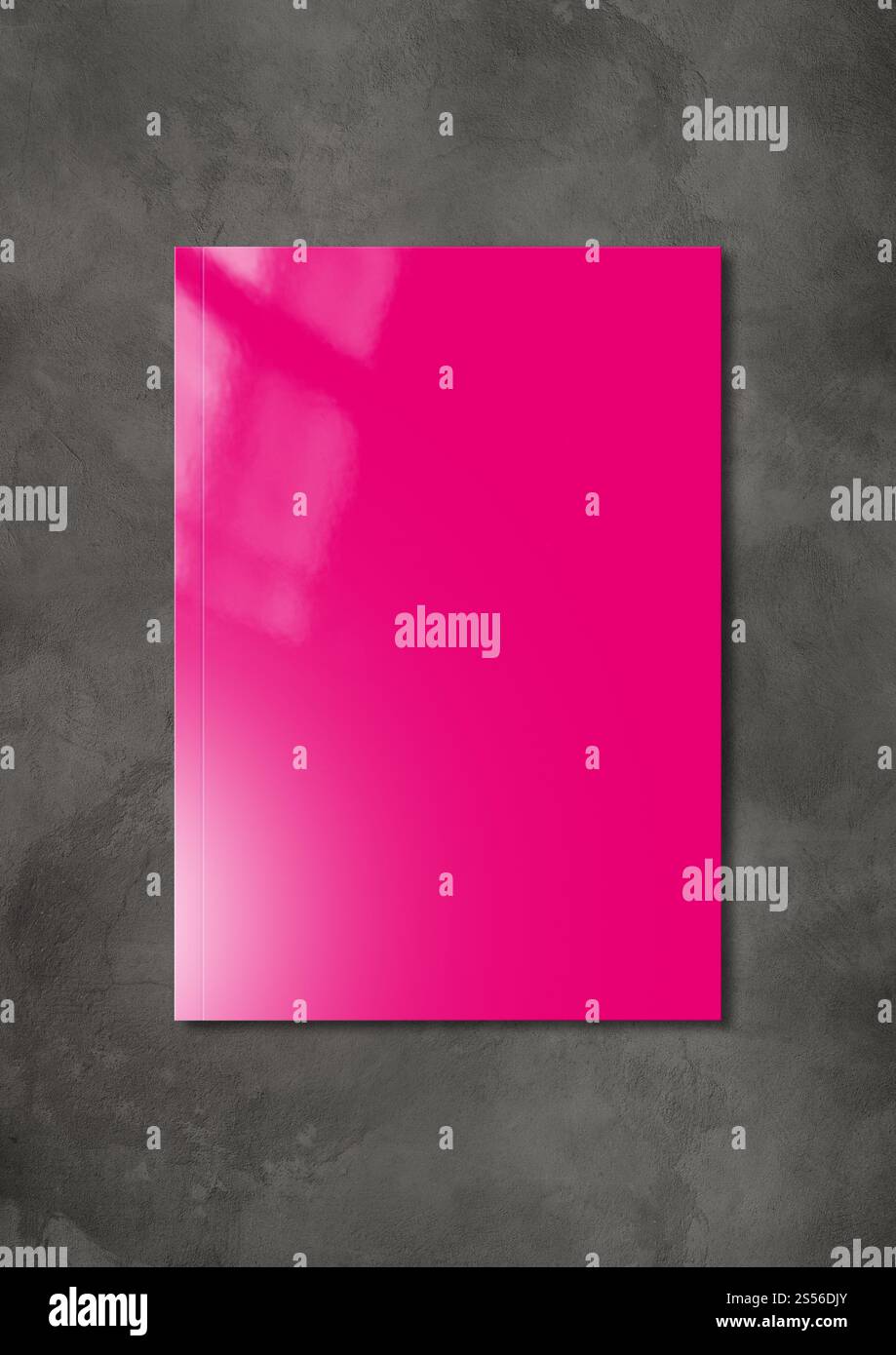 Pink booklet cover isolated on dark concrete background, mockup ...