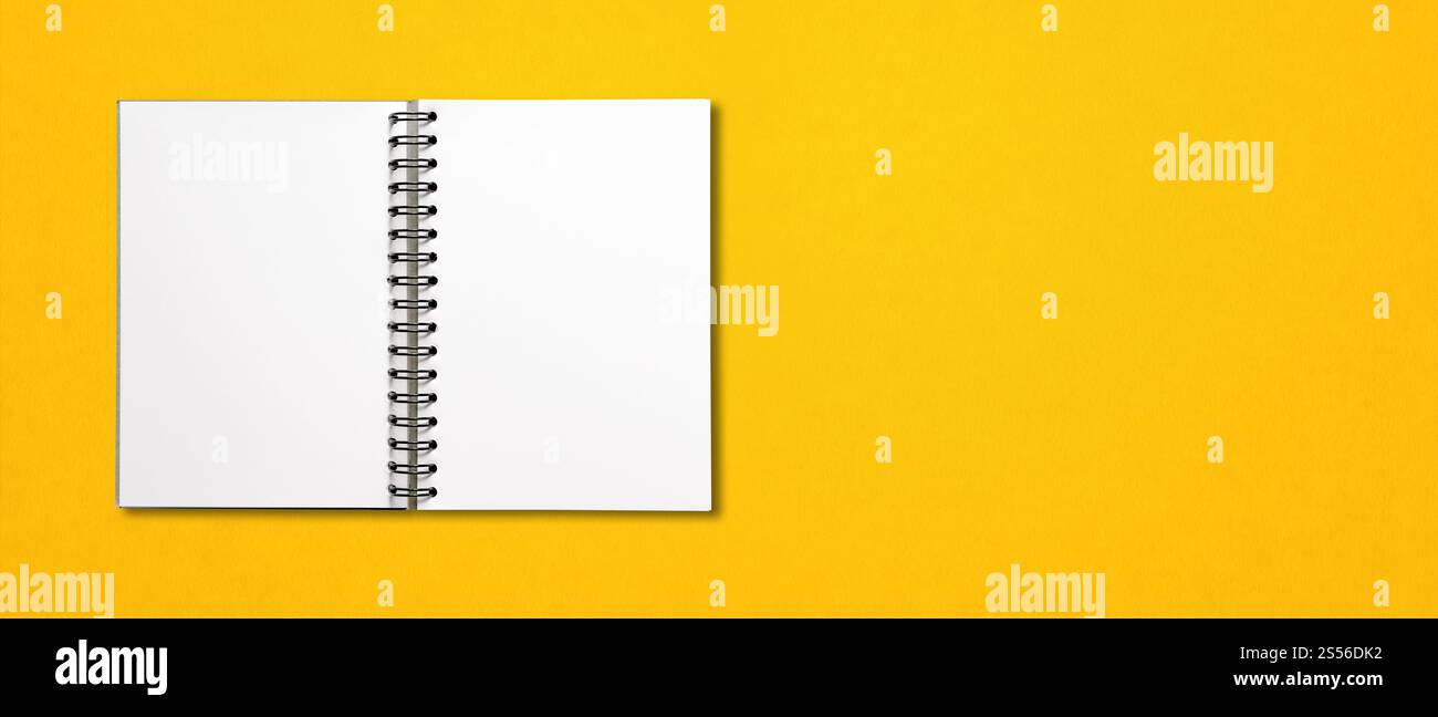 Blank open spiral notebook mockup isolated on yellow horizontal banner ...