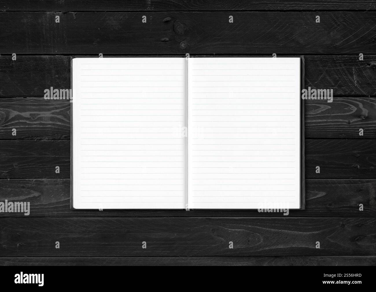 Blank open notebook mockup isolated on black wood background. Blank ...