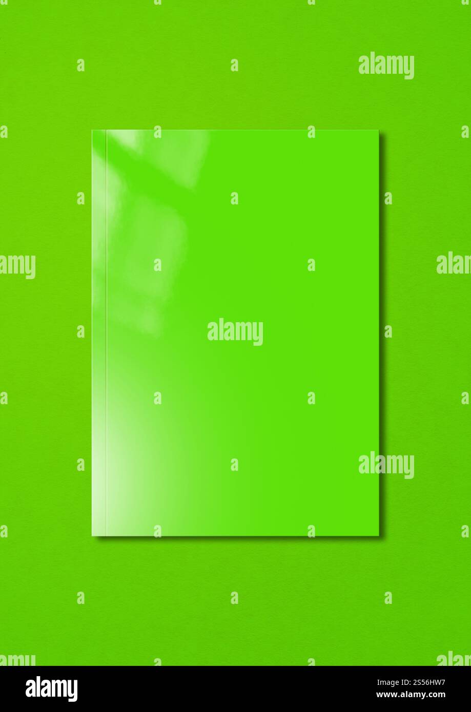 Green booklet cover isolated on colorful background, mockup template ...