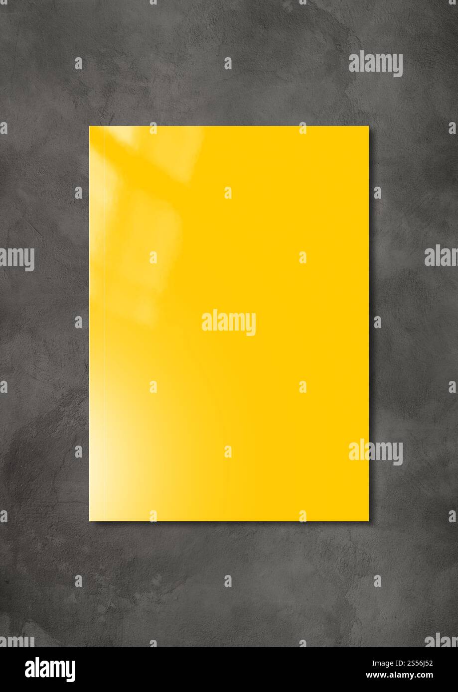 Yellow booklet cover isolated on dark concrete background, mockup ...