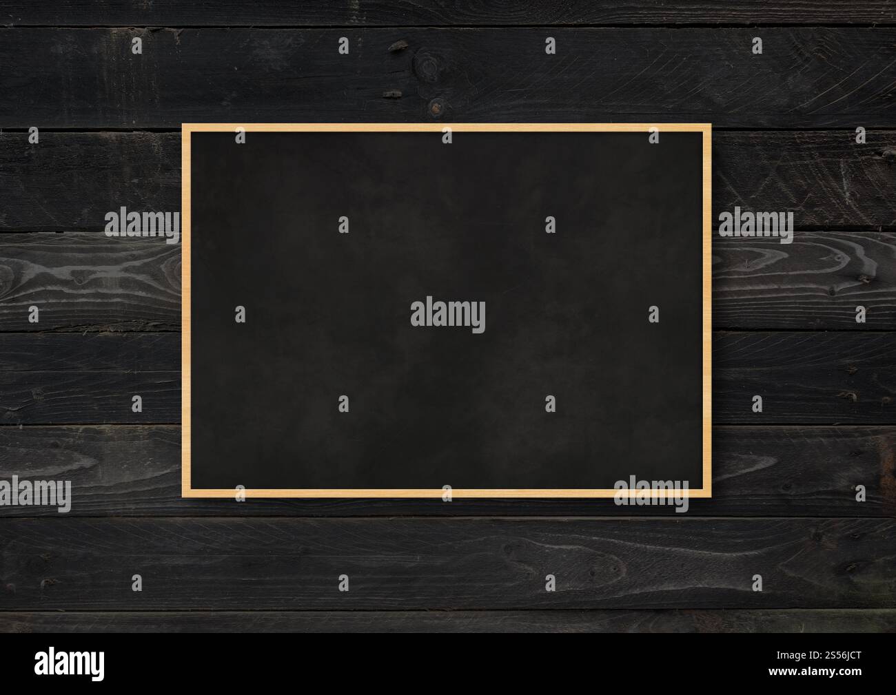 Traditional blackboard isolated on a black wood background. Blank ...