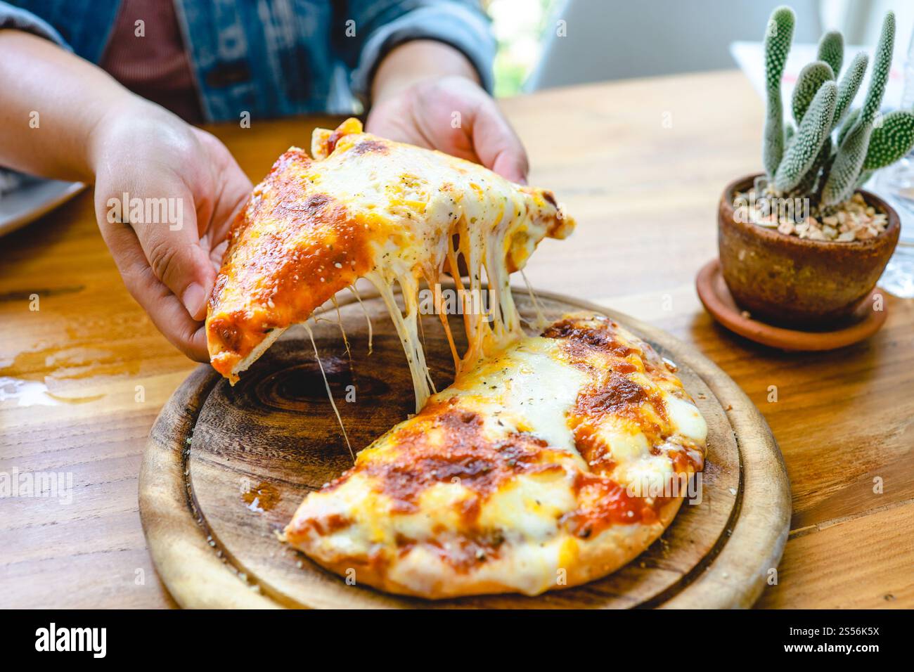 A slice of fresh hot Very cheesy vegetarian pizza mozzarella cheese ...