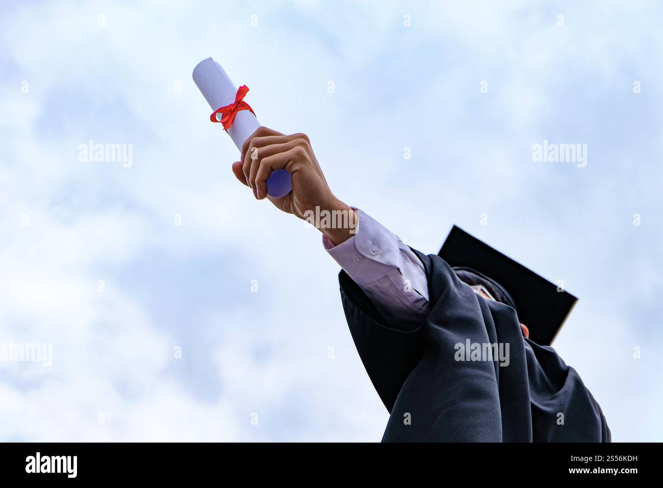 Student with congratulations, graduates wearing a graduation gown of ...