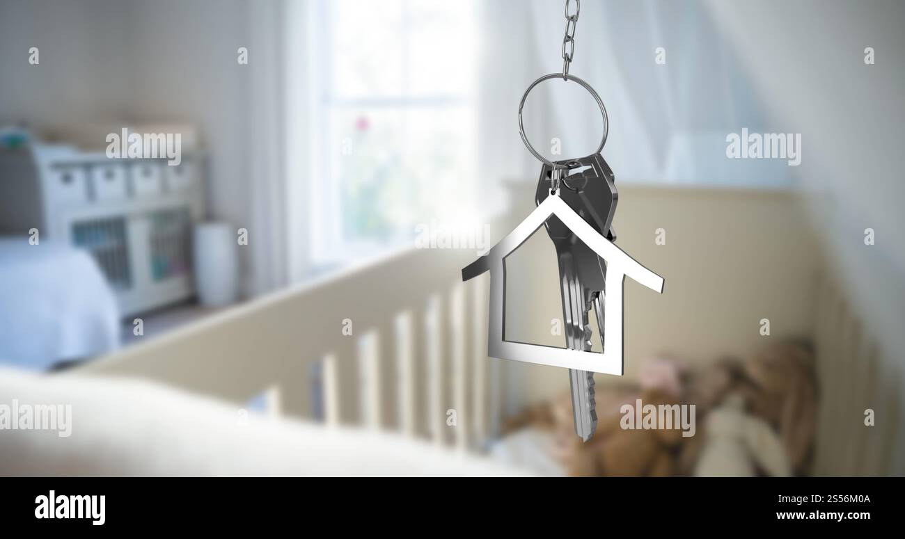 Image of dangling house key and house key over snow falling and winter ...