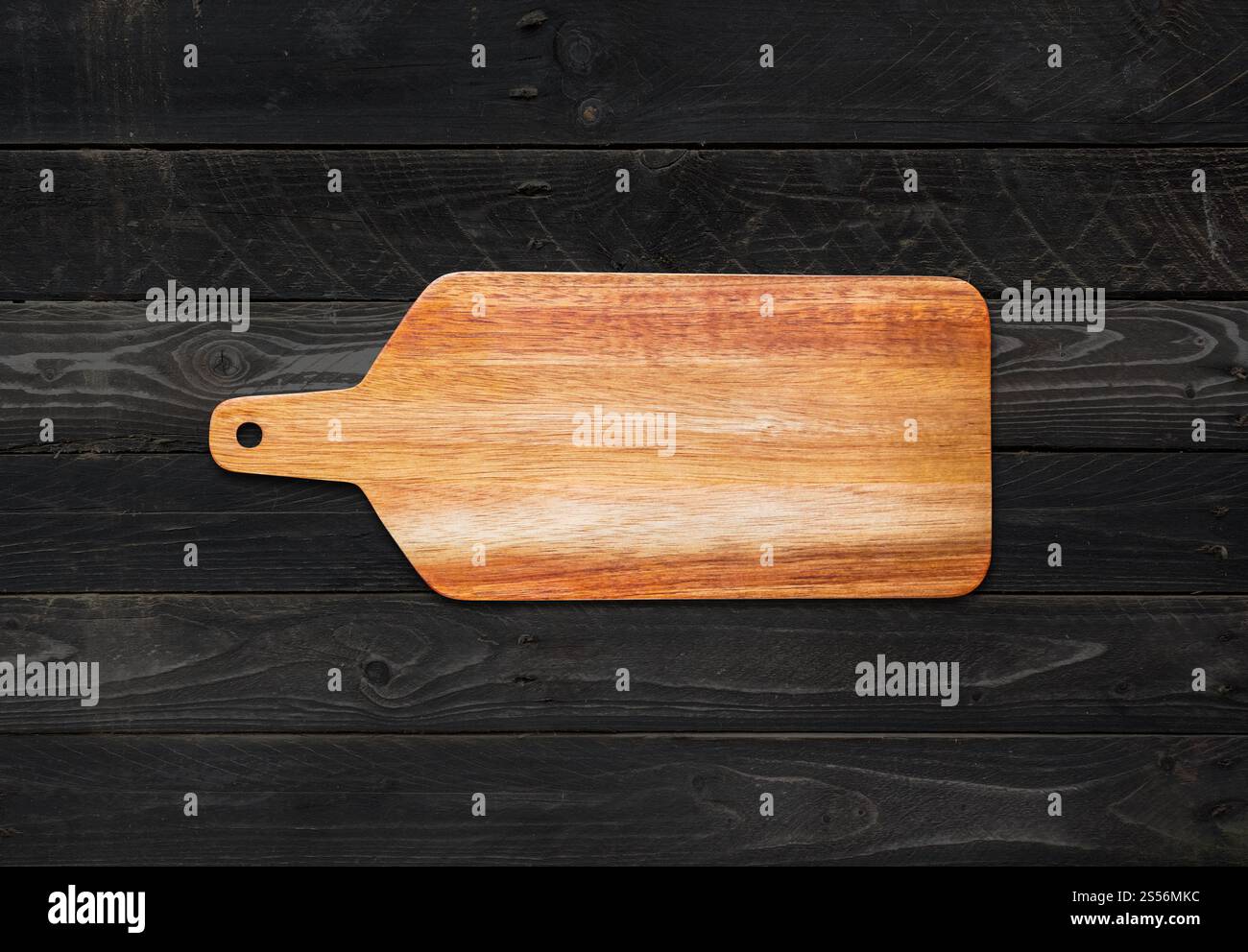 Wooden cutting board on black wood table background. Wooden cutting ...