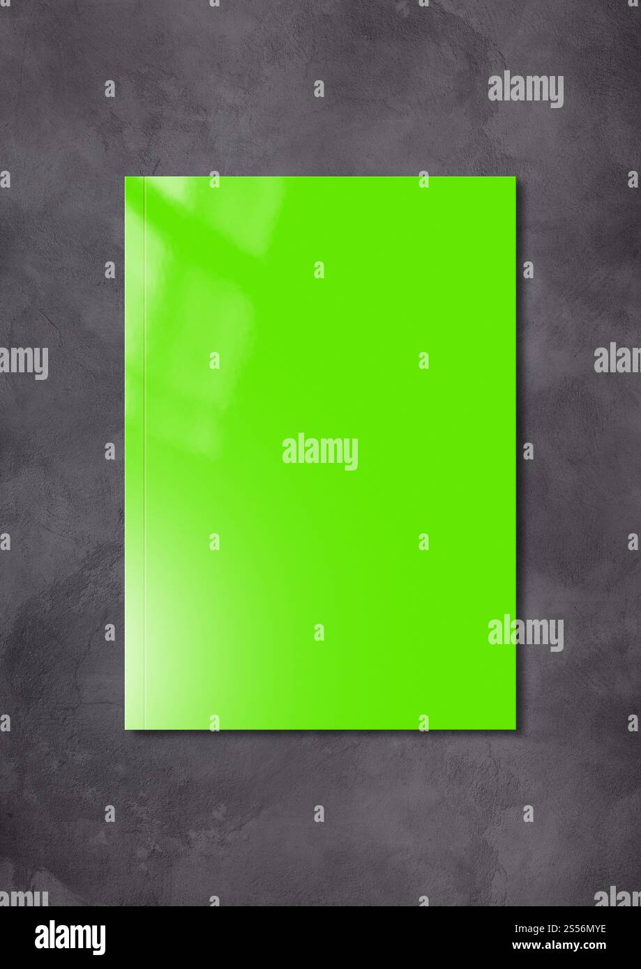 Green booklet cover isolated on dark concrete background, mockup ...
