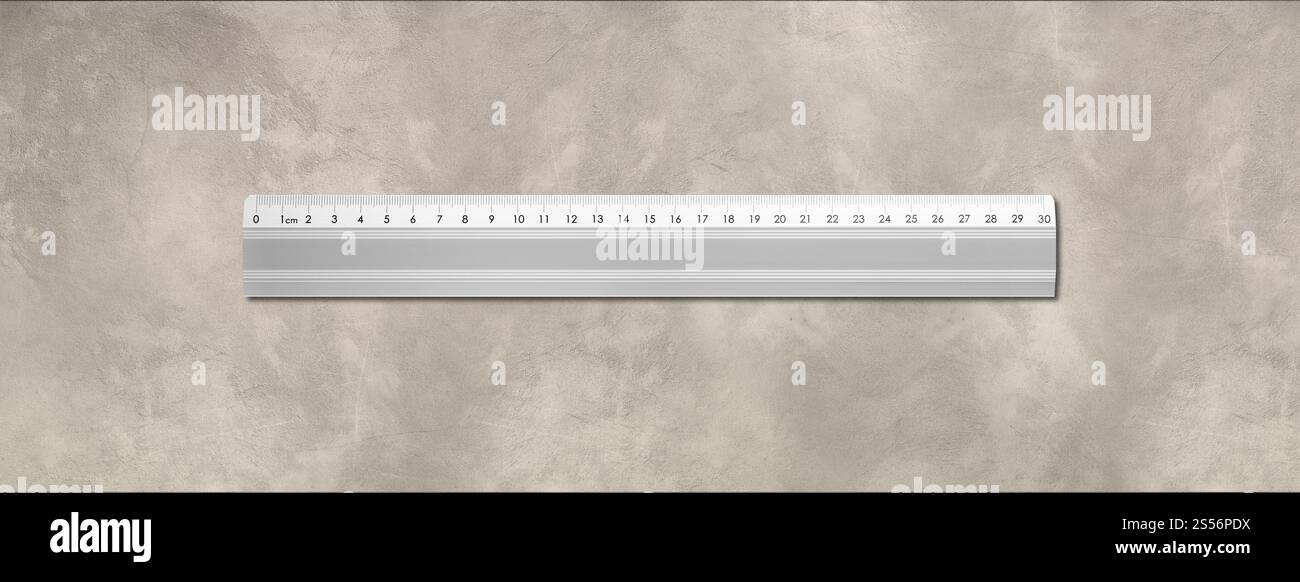 Steel metallic ruler isolated on concrete background. Metal ruler ...