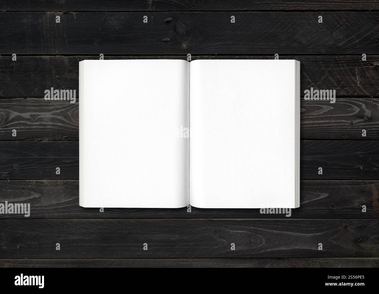 Open book isolated on black wood background. Open book isolated on ...