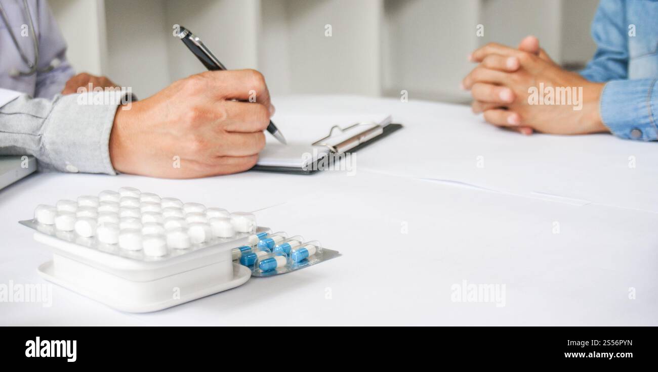 Medicine Doctor hand holding pack of different tablet blisters for ...