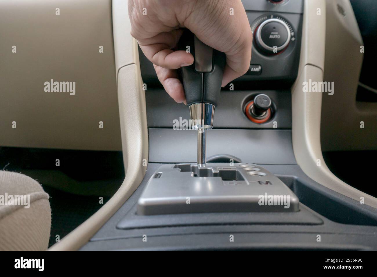 Man driving hands changing gear while driving in the car selective ...