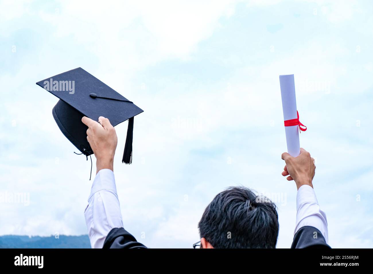 Student with congratulations, graduates wearing a graduation gown of ...