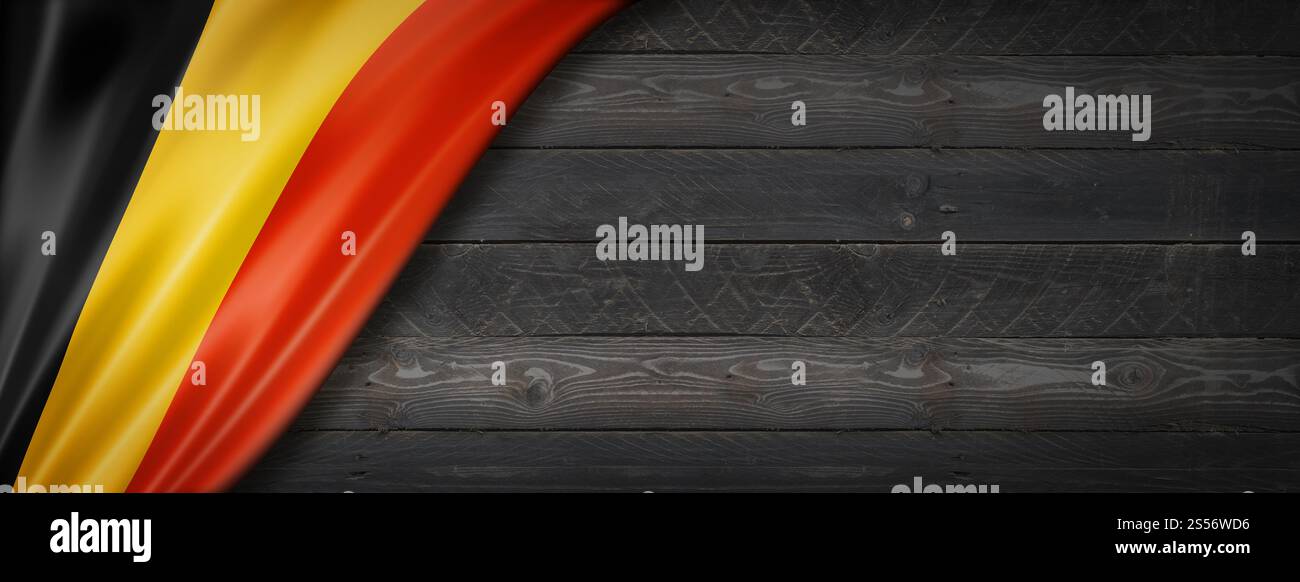 Belgium flag on black wood wall. Horizontal panoramic banner. Belgian ...