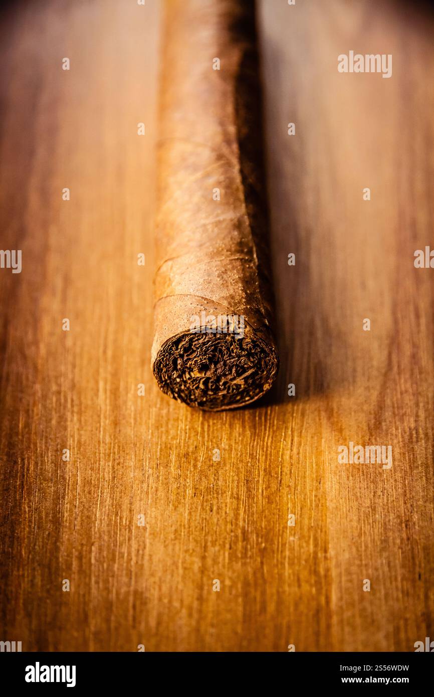 Brown cuban cigar on old wooden background. Brown cuban cigar on wooden ...