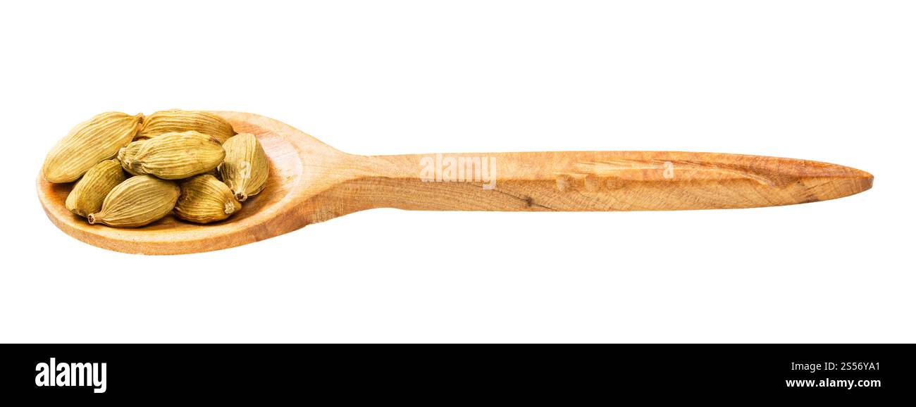 wooden spoon with cardamom seeds isolated on white background Stock ...
