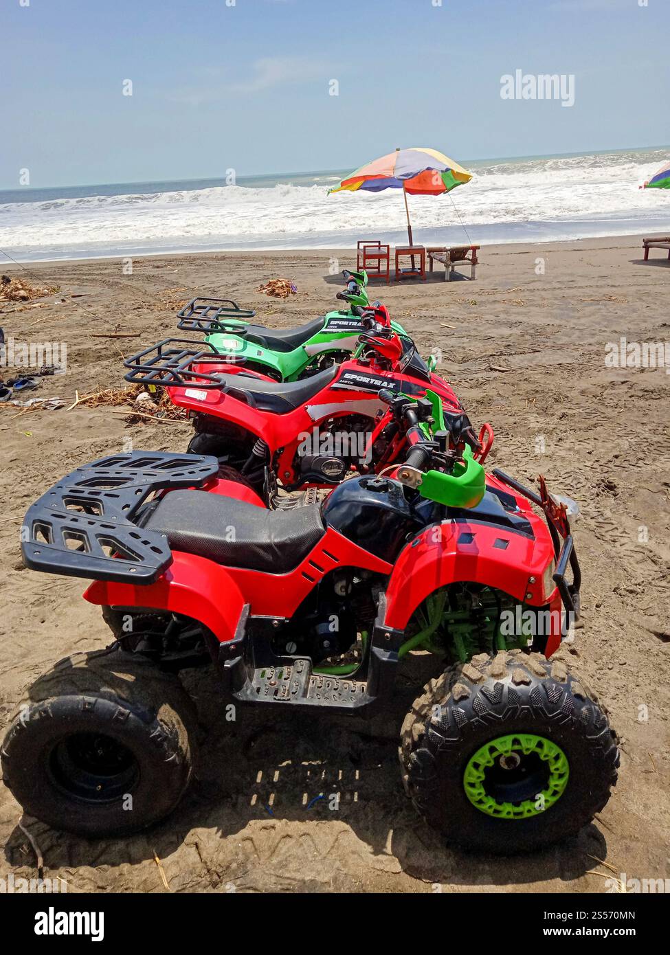 Atv on the beach seaside Stock Photo - Alamy